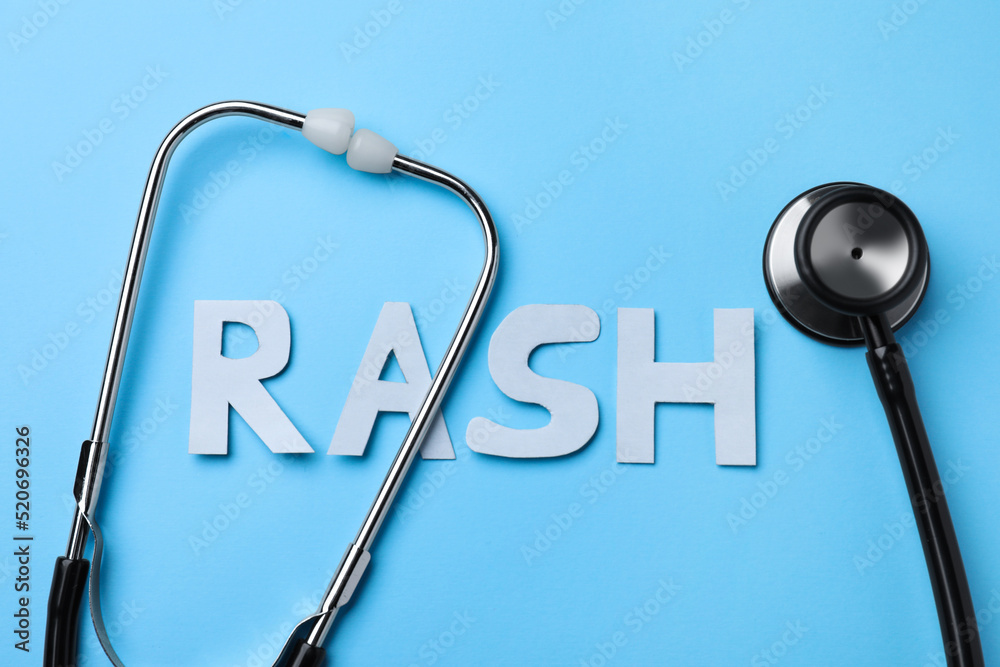 Word Rash made of paper letters and stethoscope on light blue ...