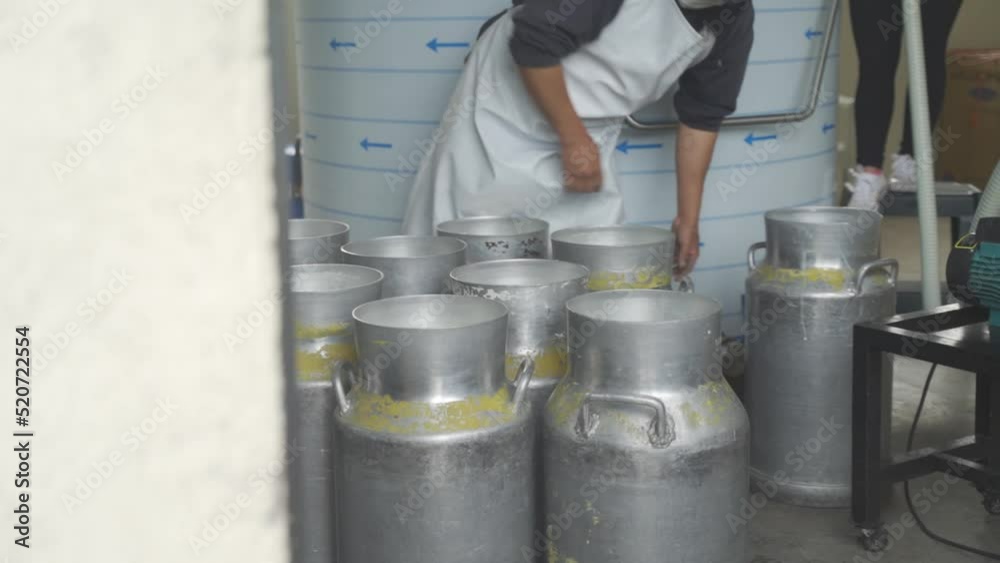 Worker in the food factory opens the pasteurization tank. Dairy ...