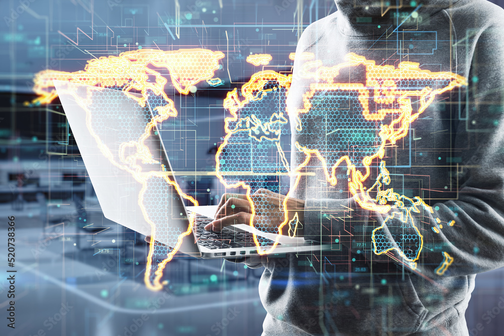 Hacker hands using laptop with abstract glowing golden map hologram on blurry background ...