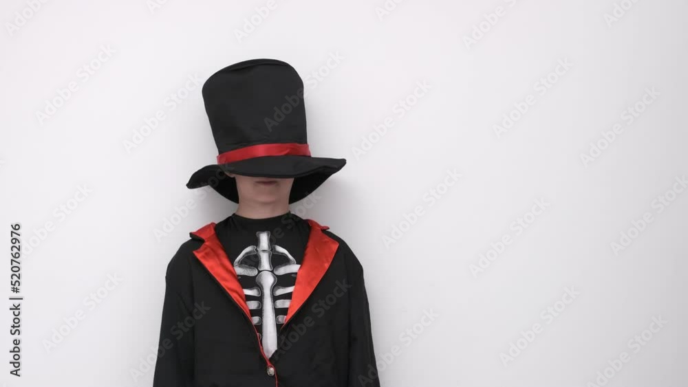 Halloween kids. boy in magic hat. boy in Halloween skeleton costume ...