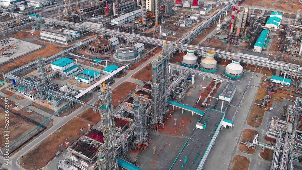 View of a large industrial chemical plant with pipelines, coolers and ...