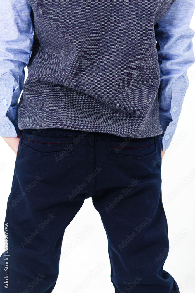 Boy, elementary school student posing in a school uniform on a white ...