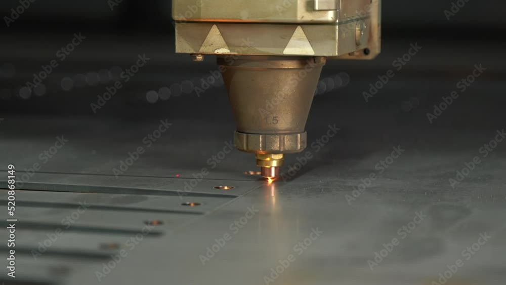 Close-up CNC laser cutting machine. The metal sheet is cut on the cnc ...