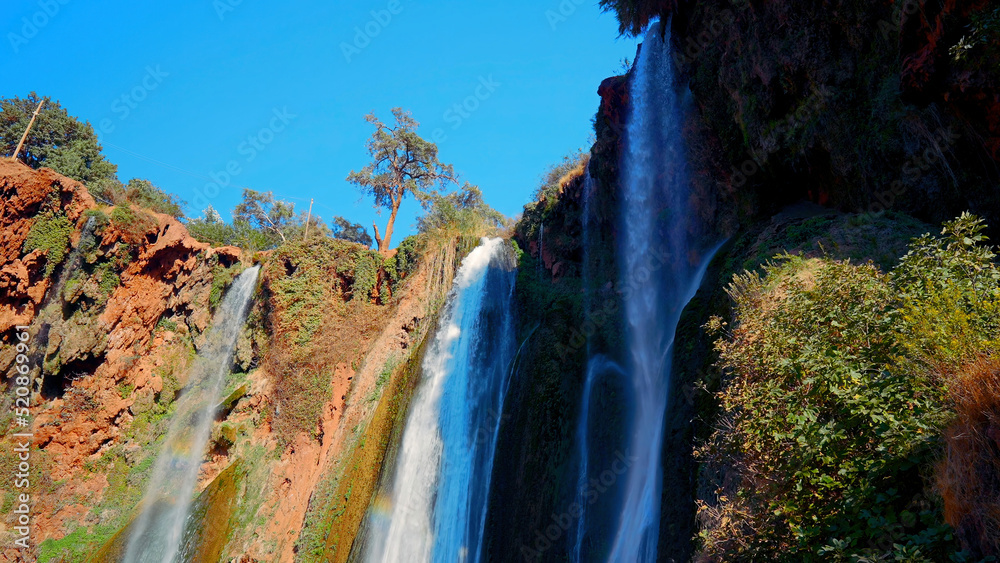 Wonderful waterfall. Action. A bright landscape with a view of a ...