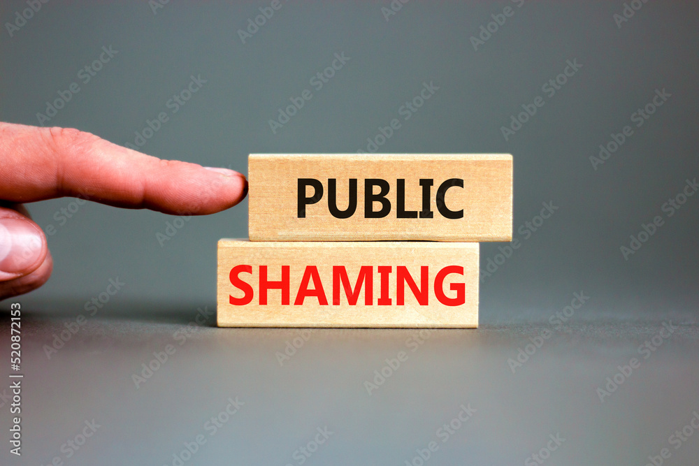 Public shaming symbol. Concept words Public shaming on wooden blocks on ...
