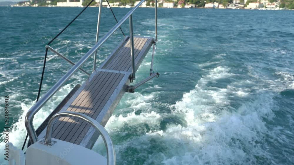 Rear of luxury yacht with stairs. Bridge of a luxurious motorized yacht ...