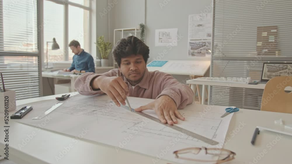 Medium closeup with slowmo of professional male Biracial architect ...