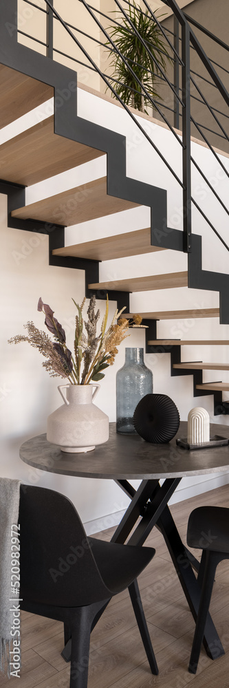 Small dining table under stairs, vertical panorama Stock Photo | Adobe ...