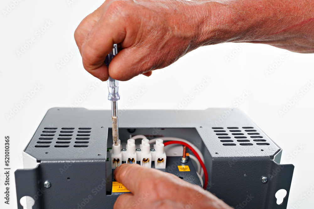 Installation of power wires of conductors in the terminal block. Stock ...