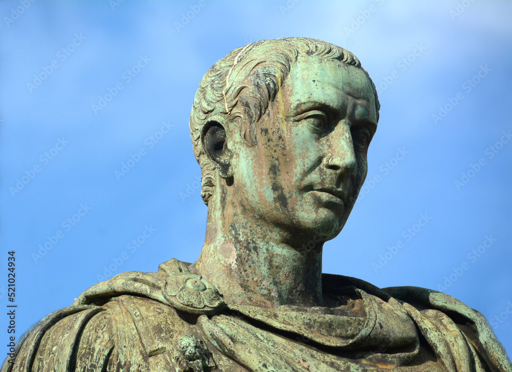the statue of Julius Caesar in front of the Porta Palatina which was ...