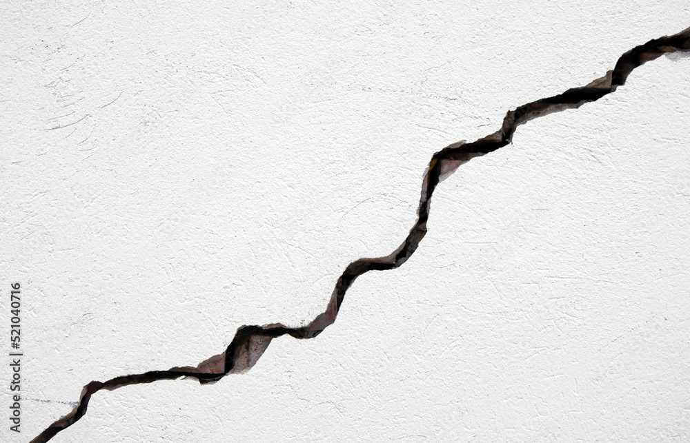 Long deep crack on the damaged wall as texture or background Stock ...