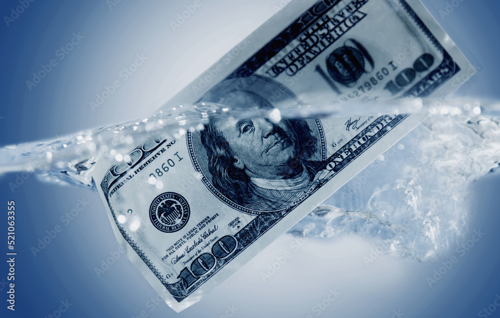 Financial default concept. Close up US Dollar sinking in water as a ...