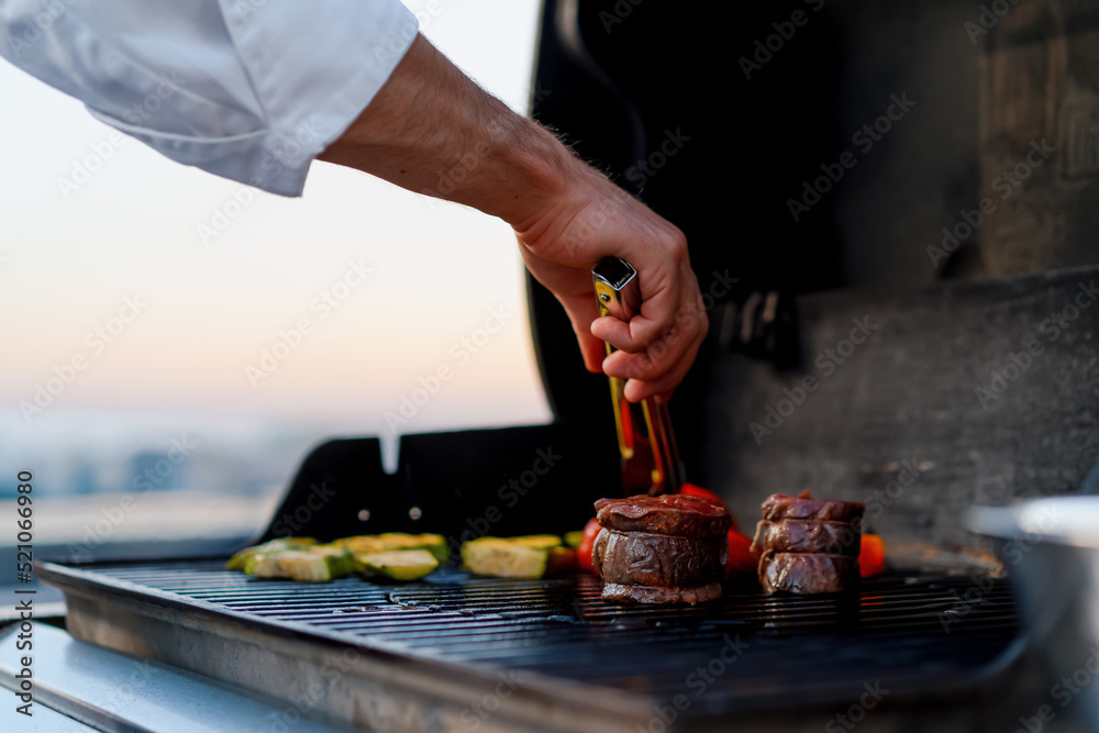 Close-up: vegetables and meat filet mignon on a barbecue grill on the ...
