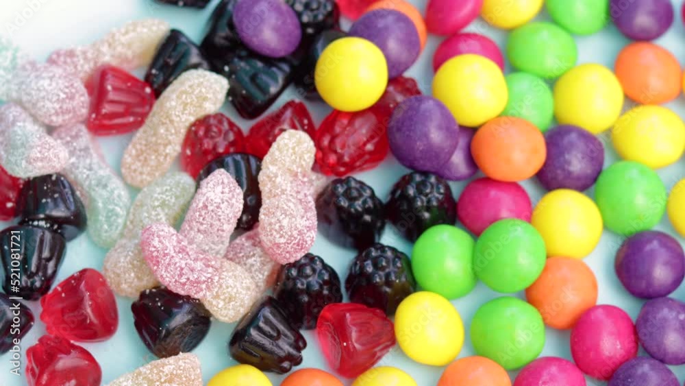 kid or woman adult hand taking one candy from a lot,stack of gummy ...