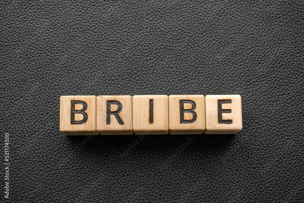Bribe - word from wooden blocks with letters, Bribe concept, black ...