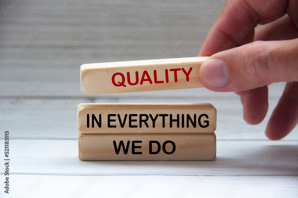 Quality in everything we do text on wooden blocks. Quality control ...