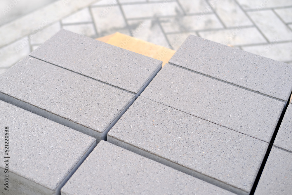 gray paving blocks on the ballast, side view, construction site of ...