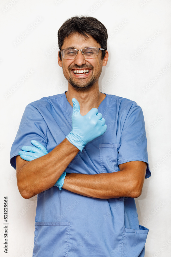Cheerful and confident doctor surgeon showing a good gesture and thumbs ...