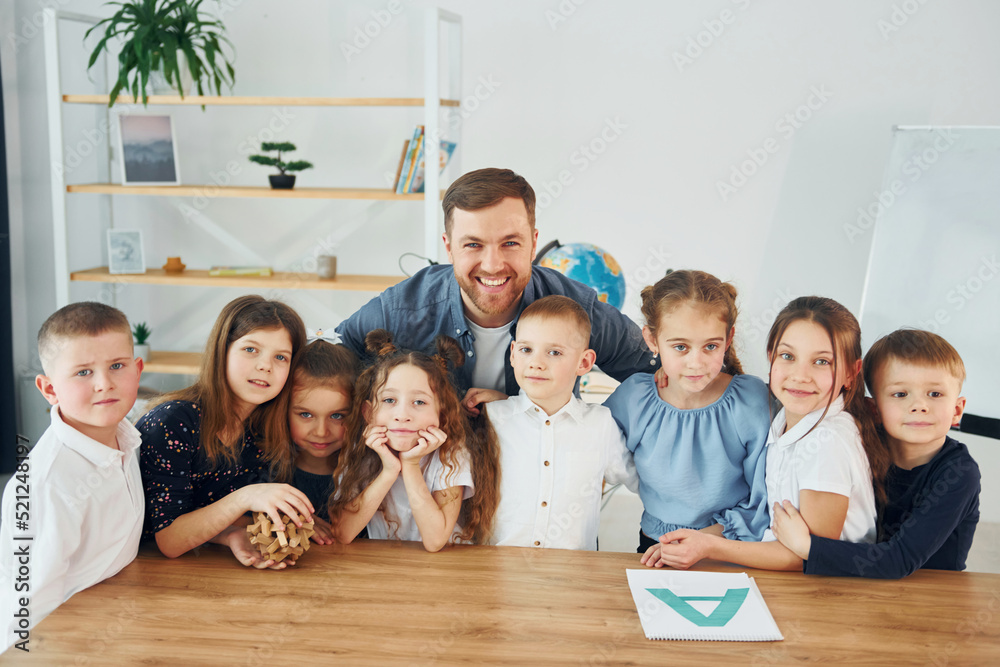 Standing and posing. Smiling together. Group of children students in ...