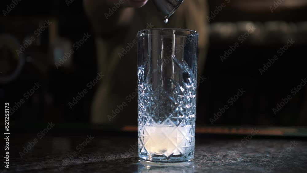 cocktail. making cocktail. close-up. Bartender pours alcoholic drink ...