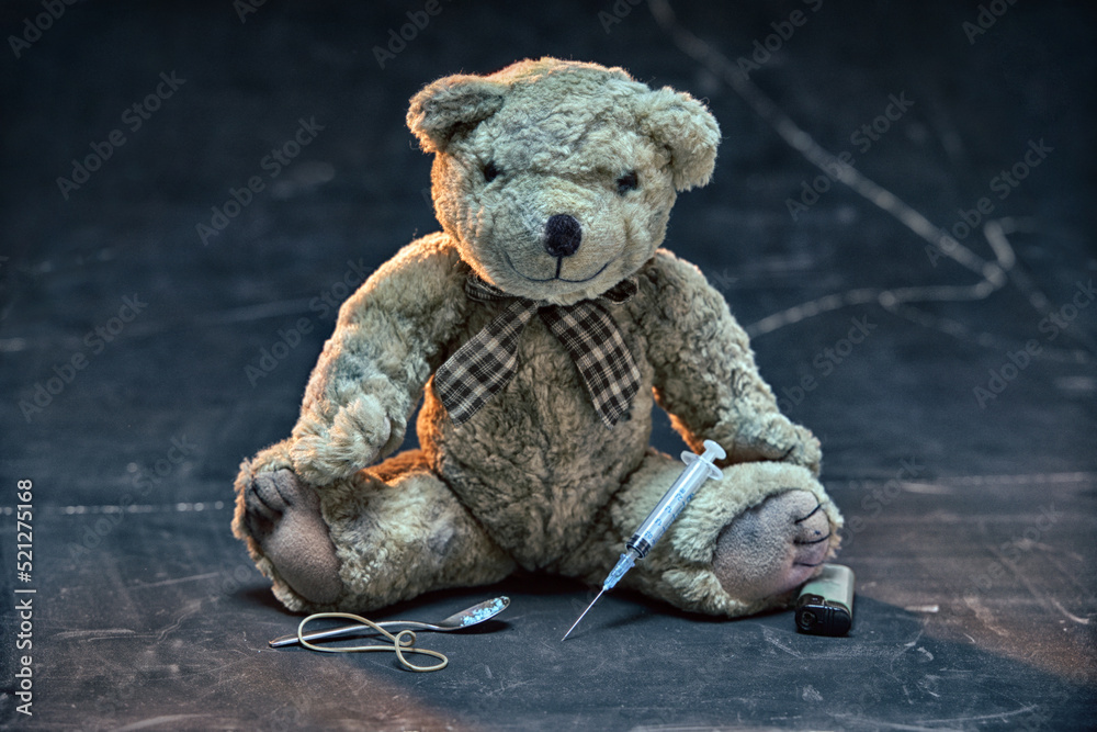 The Teddy bear symbolizing a child. Teddy bear are drug addict. Concept ...