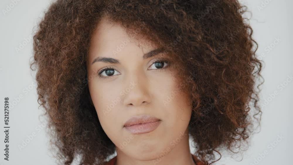 Extreme close up headshot female serious calm face with perfect skin ...