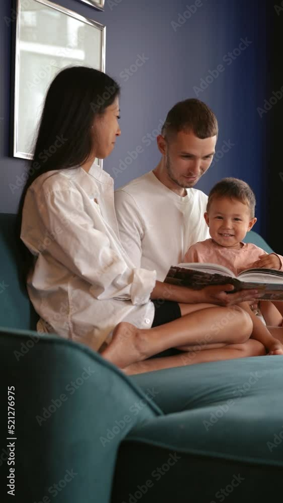 parent and child reading a book Stock Video | Adobe Stock