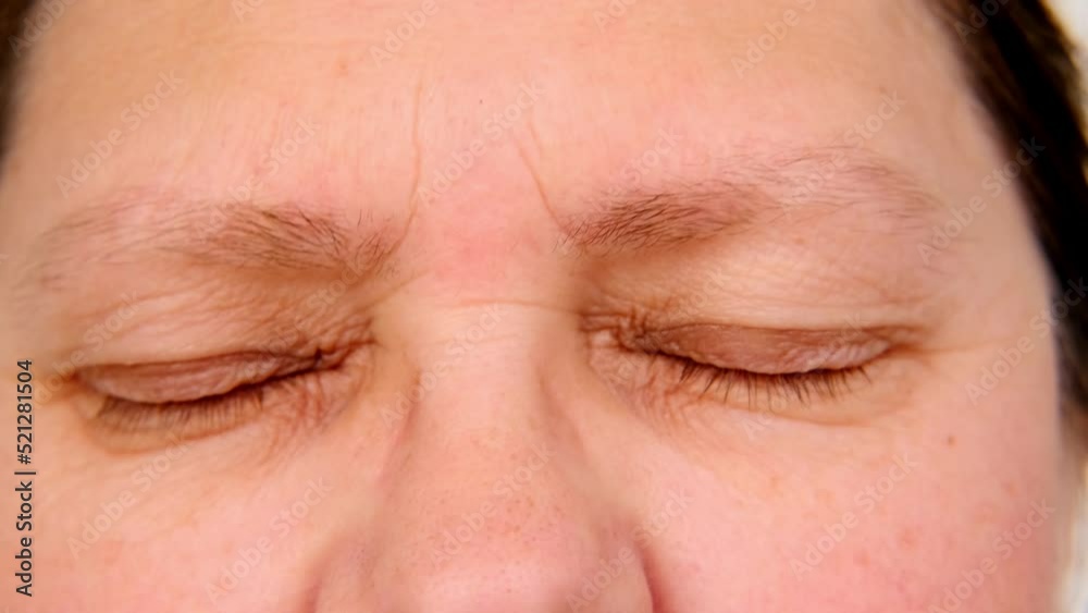 close up part of mature woman 50 years face, human eye, small wrinkles ...