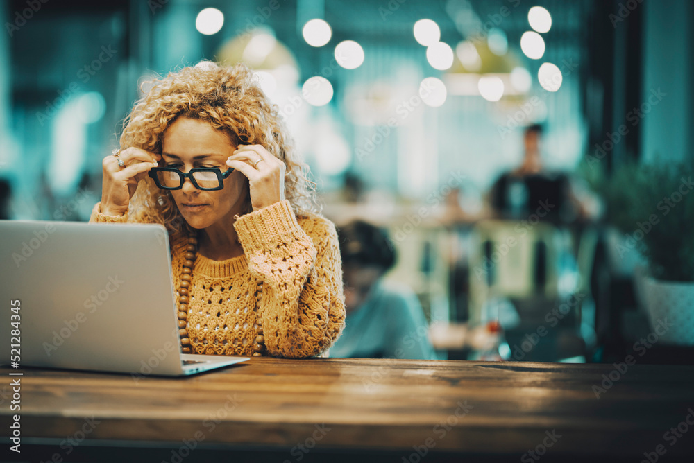 Concentrated and stressed caucasian adult woman at work on a laptop ...