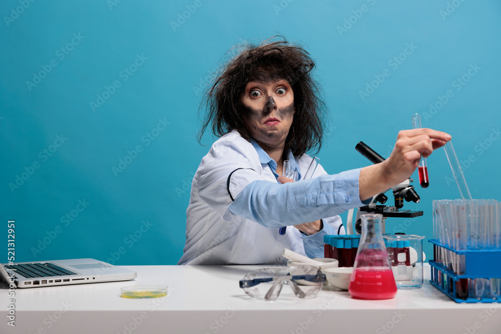 Dumb looking crazy chemist with wacky hairstyle and dirty face sitting ...