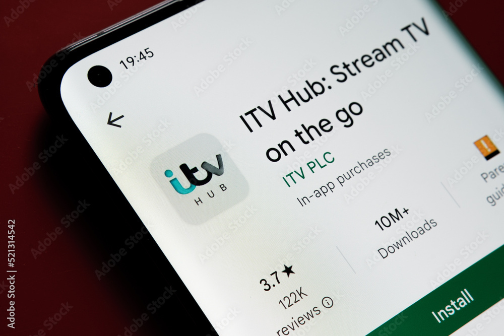 ITV Hub app seen in Google Play Store on the smartphone screen placed ...