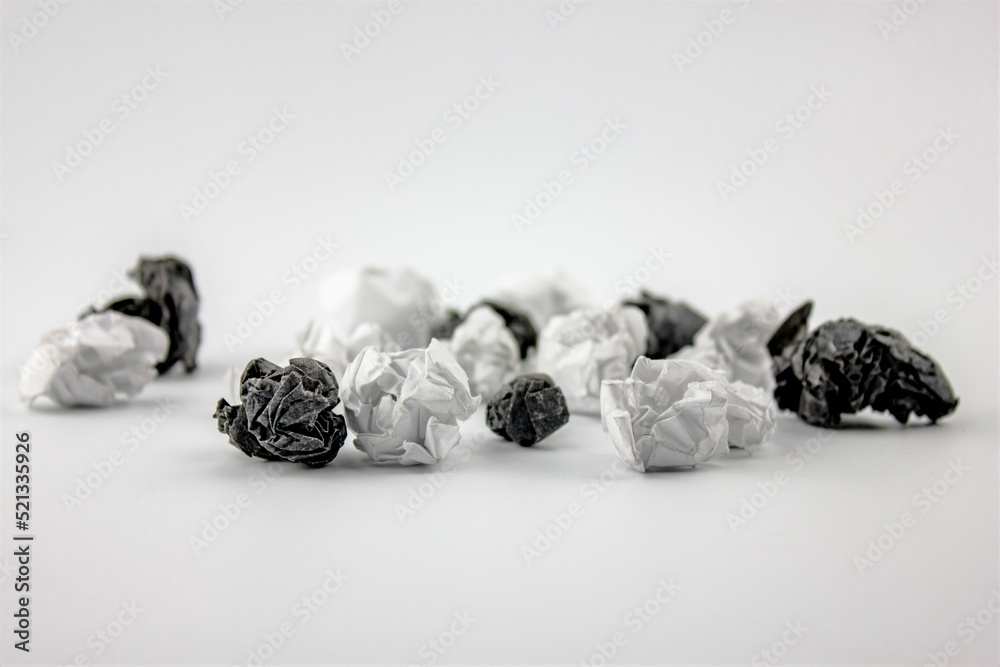 Crumpled pieces of paper white and black on an isolated white ...