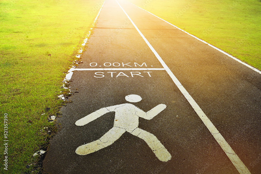 The line beginning on a paved road with sunlight coming from its ...