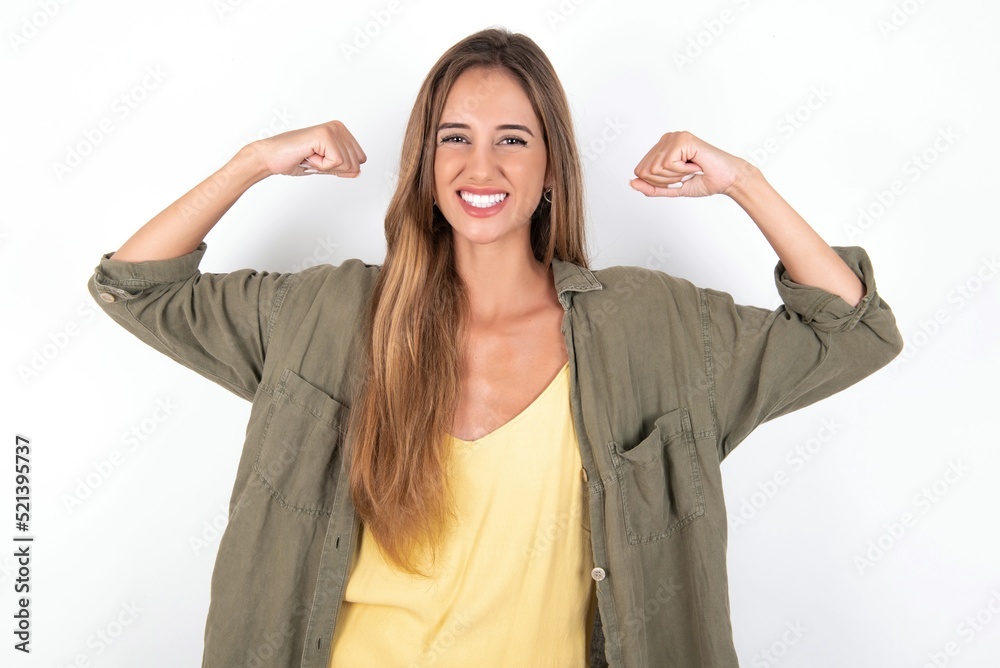 Strong powerful MODEL toothy smile, raises arms and shows biceps. Look ...