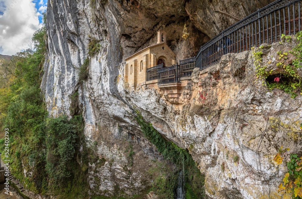 Outside view of the Holy Cave Covadonga built in the mountain Stock ...