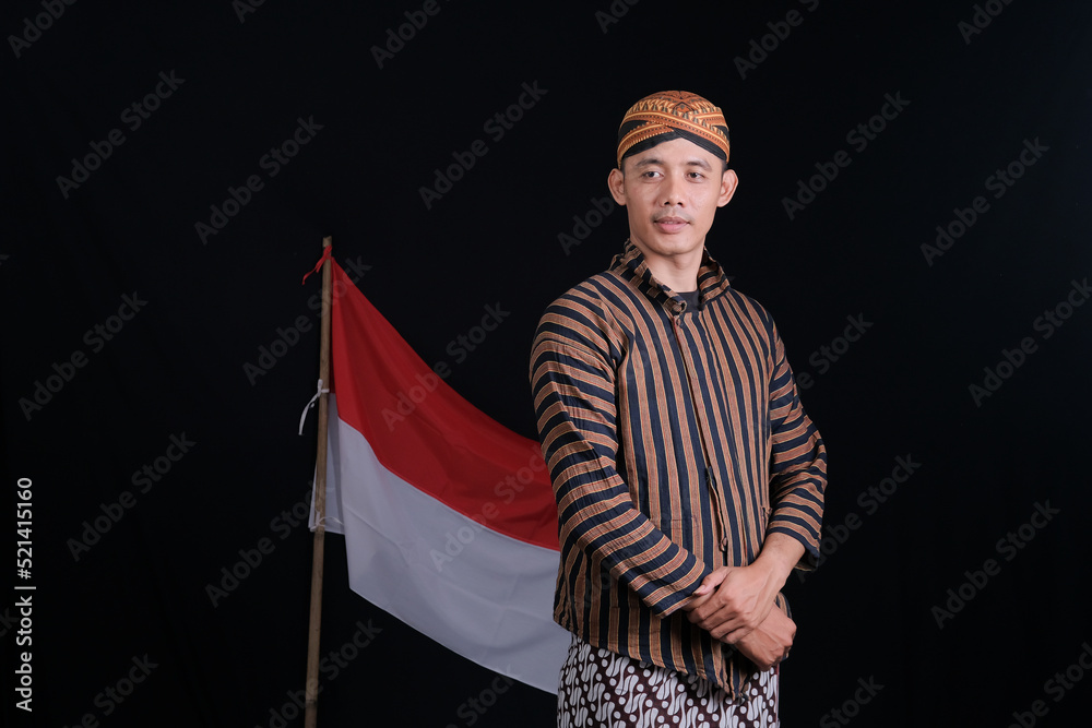 Men wearing traditional Javanese batik clothes to show the richness of ...