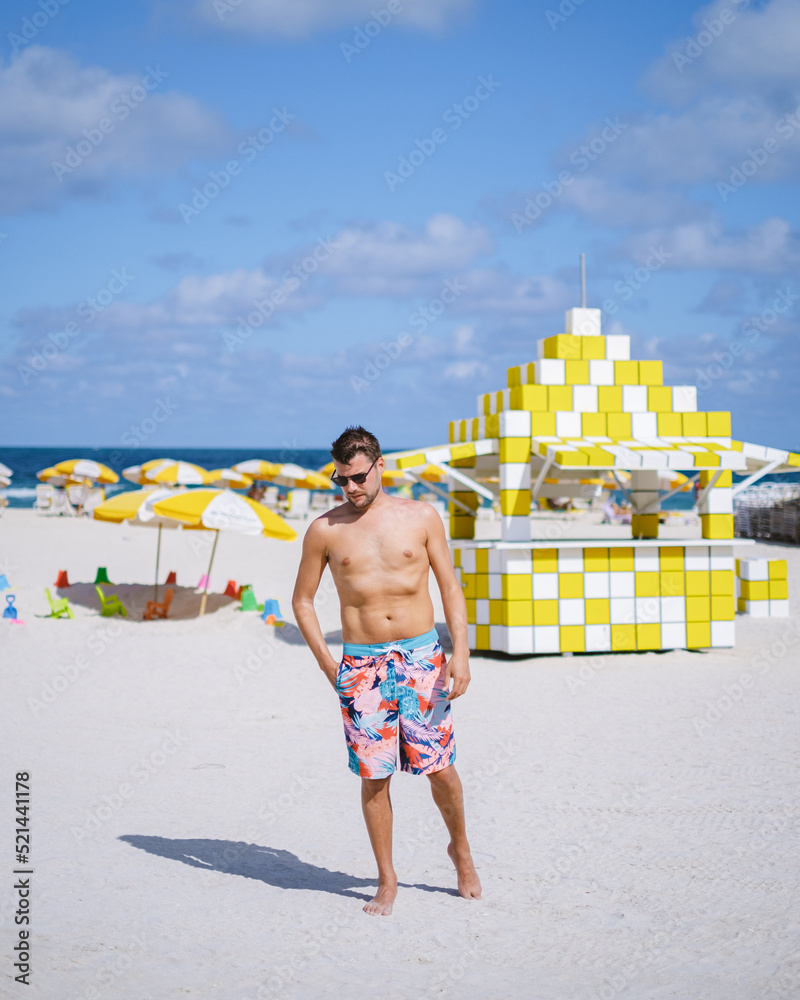 Miami beach, young men on the beach, lifeguard hut Miami beach Florida ...