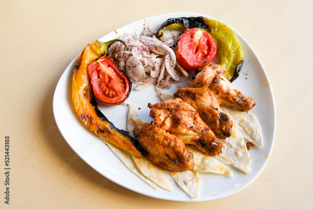 Chicken wings barbeque in a dish with BBQ grill sauce . Izgara tavuk ...