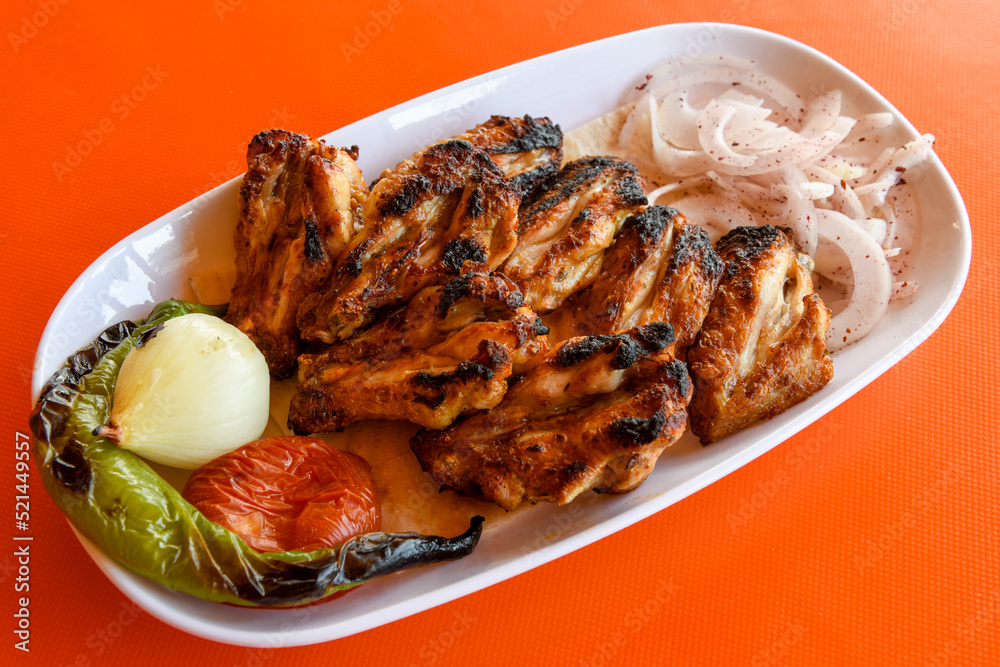 Chicken wings barbeque in a dish with BBQ grill sauce . Izgara tavuk ...