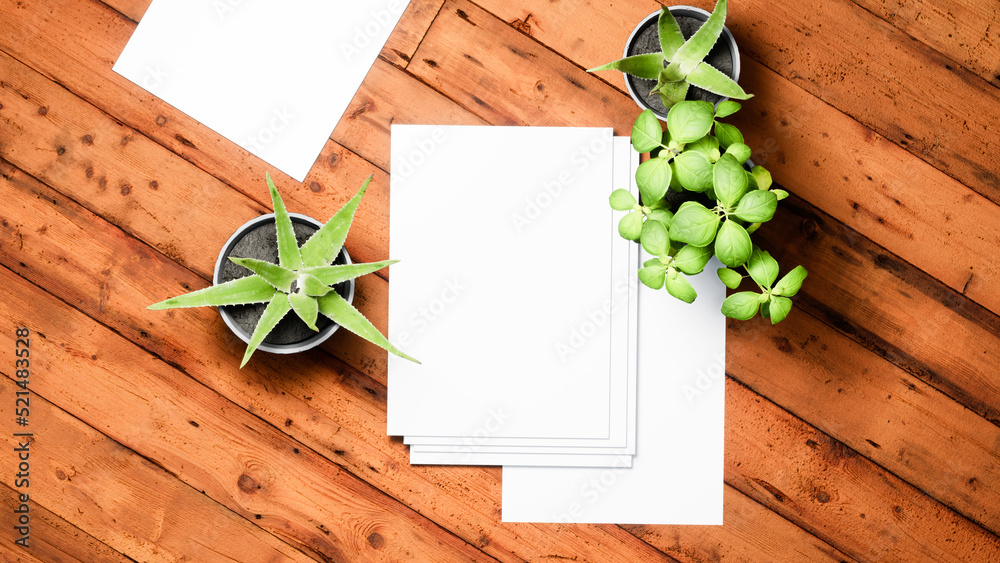 Mockup white paper on the wooden brown table background with tropical ...