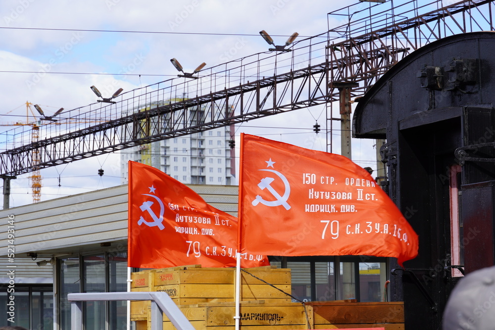 Two retro red flags waving in the wind with the symbols of the Soviet ...