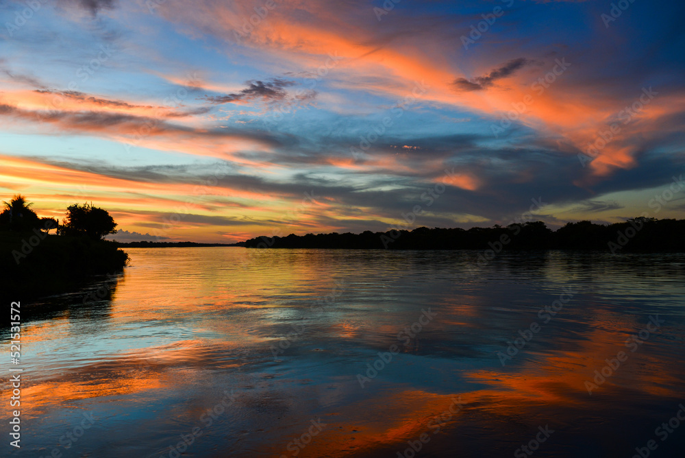 Beautiful sunset on the Guaporé - Itenez river from the remote village ...