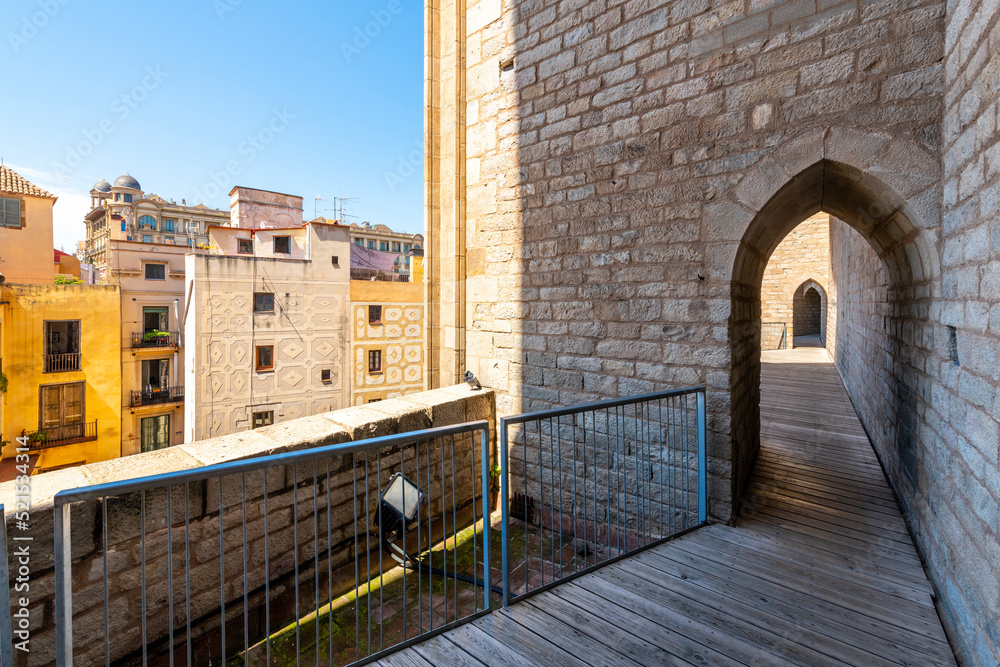 An arched tunneled walkway along the rooftop terrace of the Gothic ...