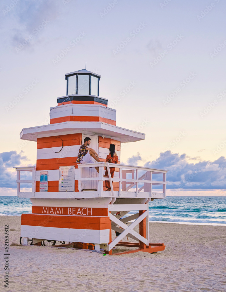 Miami Beach, a couple of men and women on the beach in Miami Florida ...