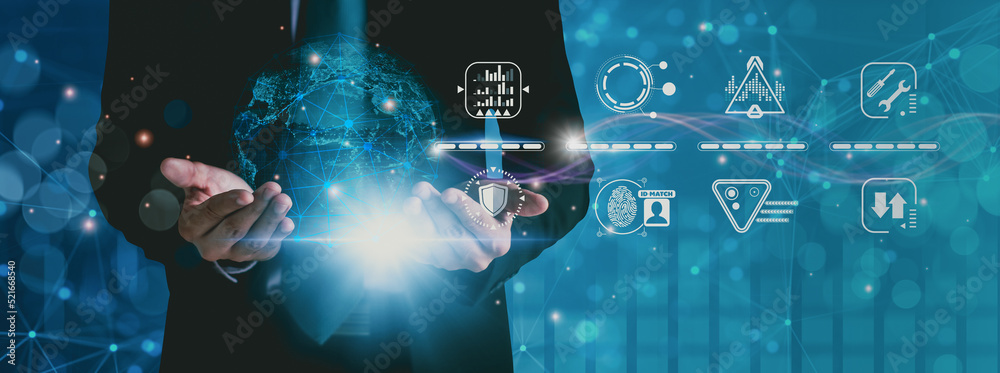 Businessman holding earth hologram,analysis business and economic data ...