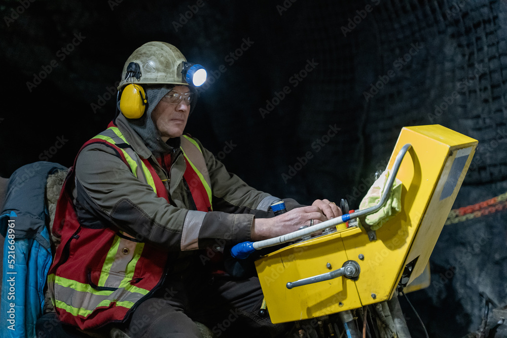 The driller works in an underground mine on a stationary drilling ...