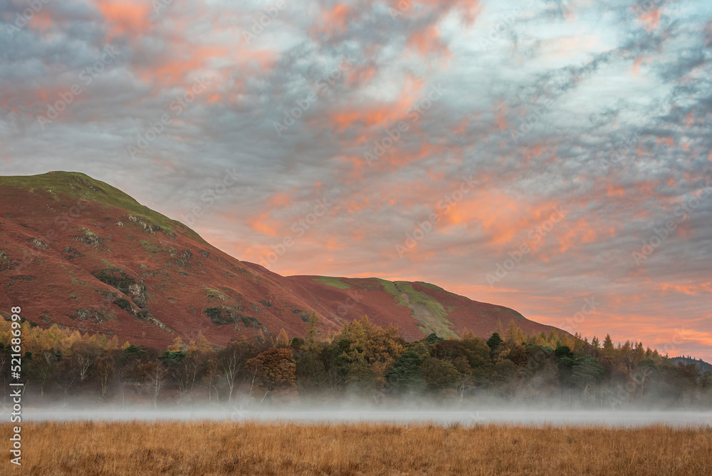 Absolutely stunning vibrant Autumn sunrise landscape image looking from ...