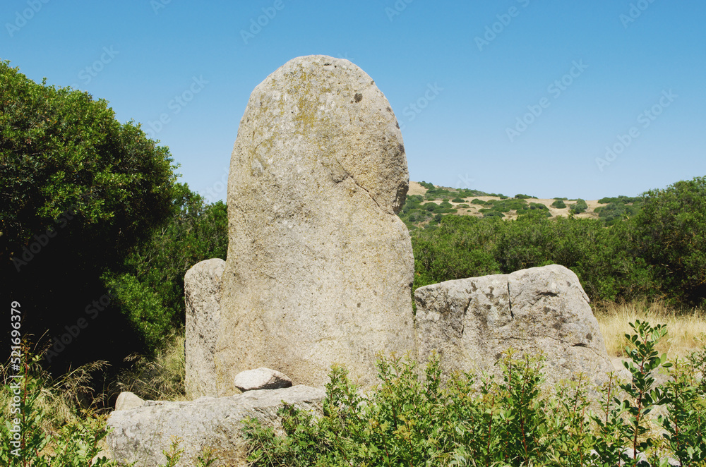 Arched stele seen from behind in the nuragic-era archaeological site of ...