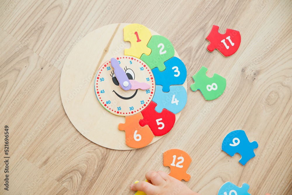 Boy learning time with wooden clock. Toy for Learning method for ...