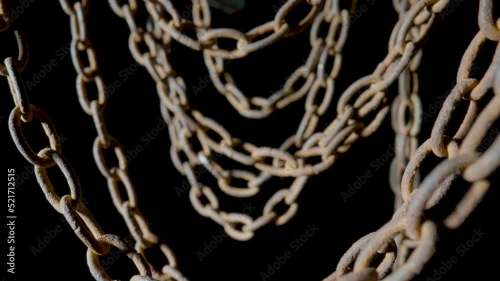 Stockvideon Old metal chain with rusted links on black isolated studio ...